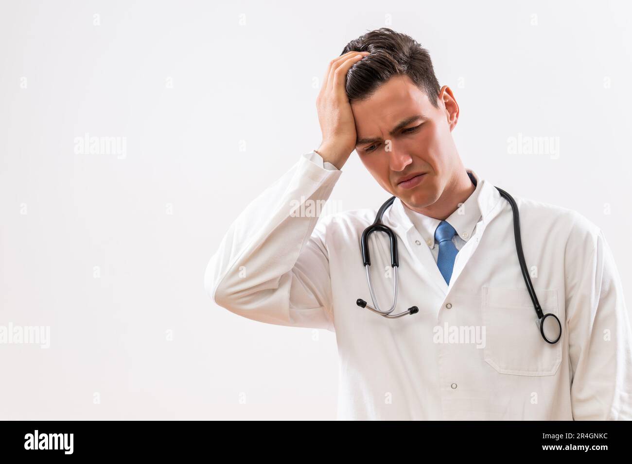 Image of worried and tired doctor thinking Stock Photo - Alamy