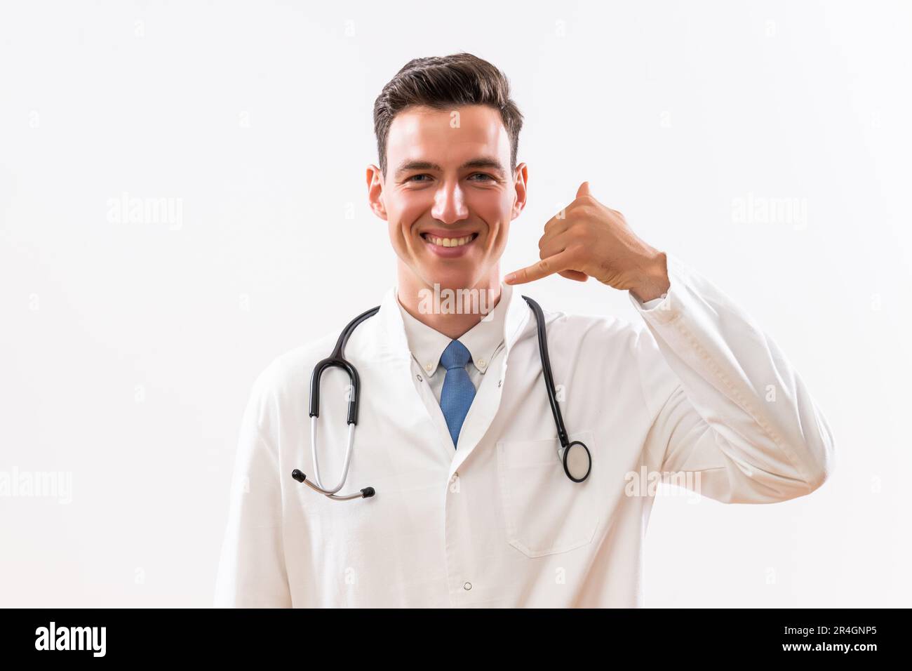 Image of doctor showing call me gesture Stock Photo - Alamy