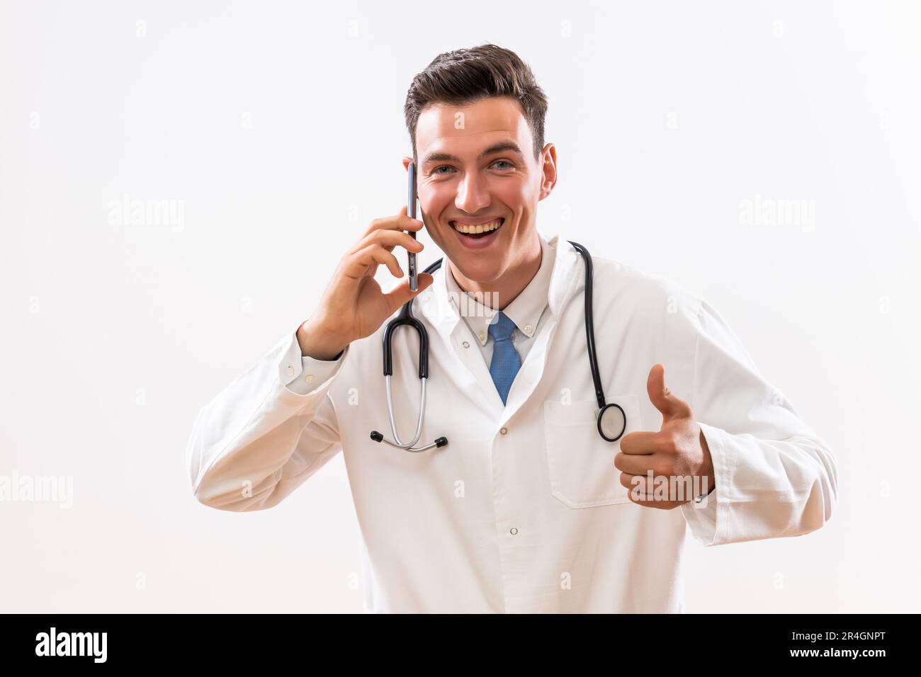 Image of happy doctor talking on the phone and showing thumb up Stock ...