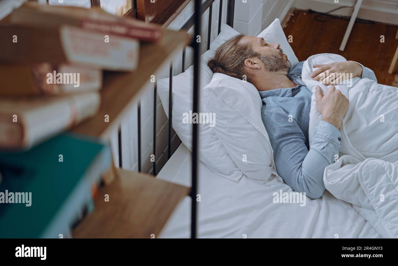 Male sleeping on bed in bedroom at home Stock Photo - Alamy