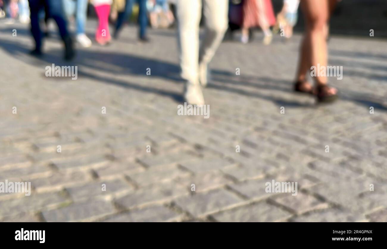 walking, Blurred background with feet of women and men walking on ...