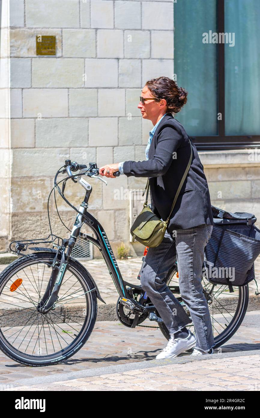 Woman pushing her bicycle hi-res stock photography and images - Alamy