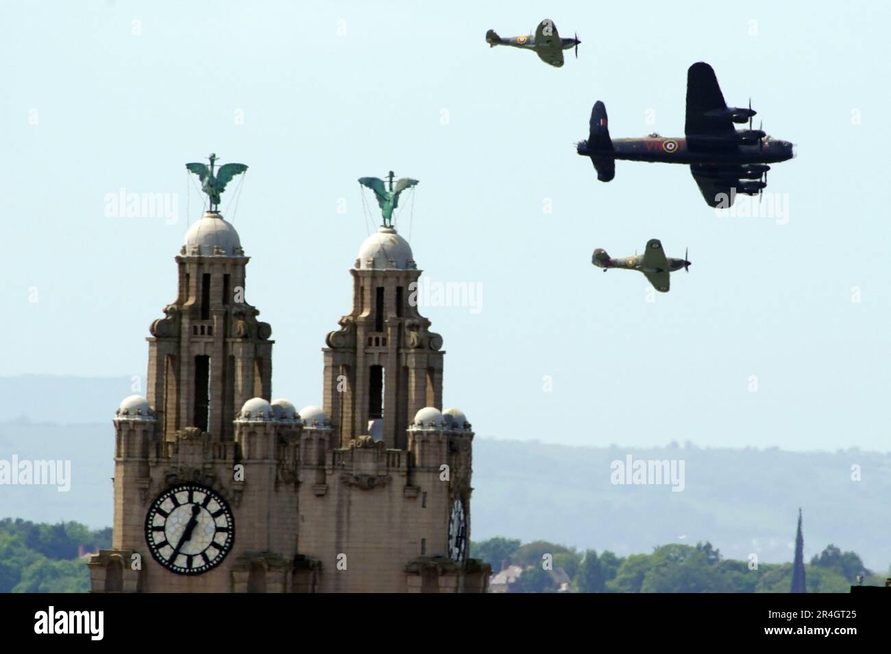 A Lancaster Bomber, Spitfire and Hurricane flypast over the Royal Liver ...