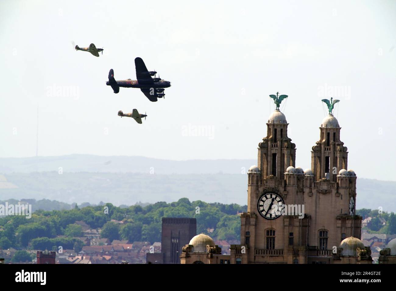 A Lancaster Bomber, Spitfire and Hurricane flypast over the Royal Liver ...