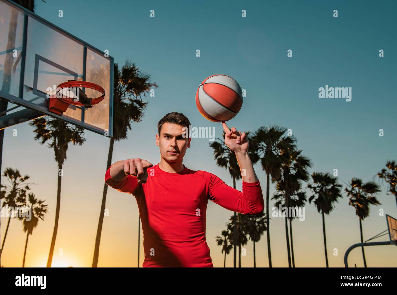 Basketball player shooting ball in hoop outdoor court. Urban youth game ...