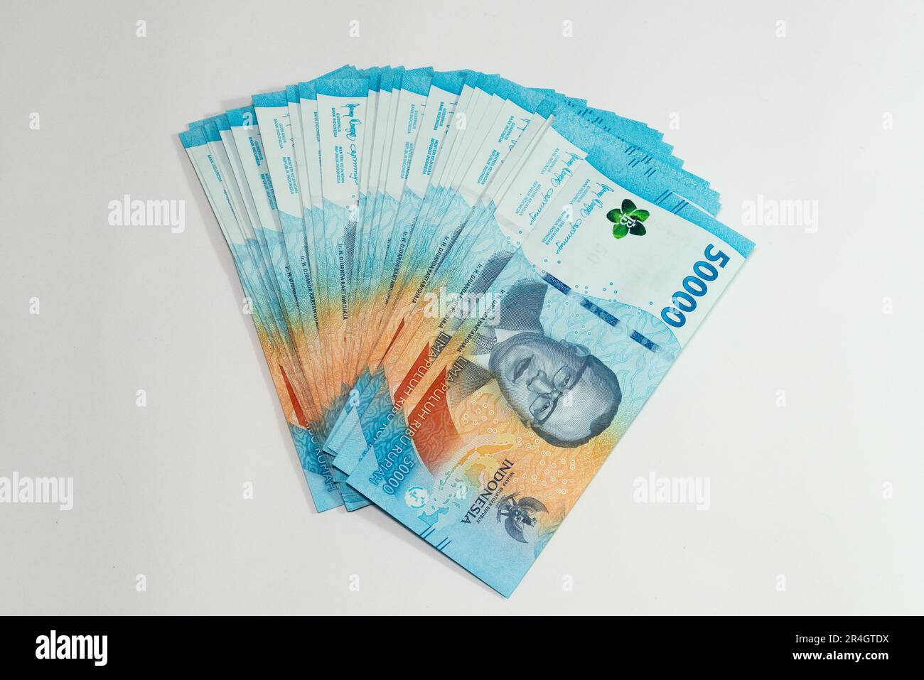 Stack of Indonesia currency money of 50000 rupiah on white background ...