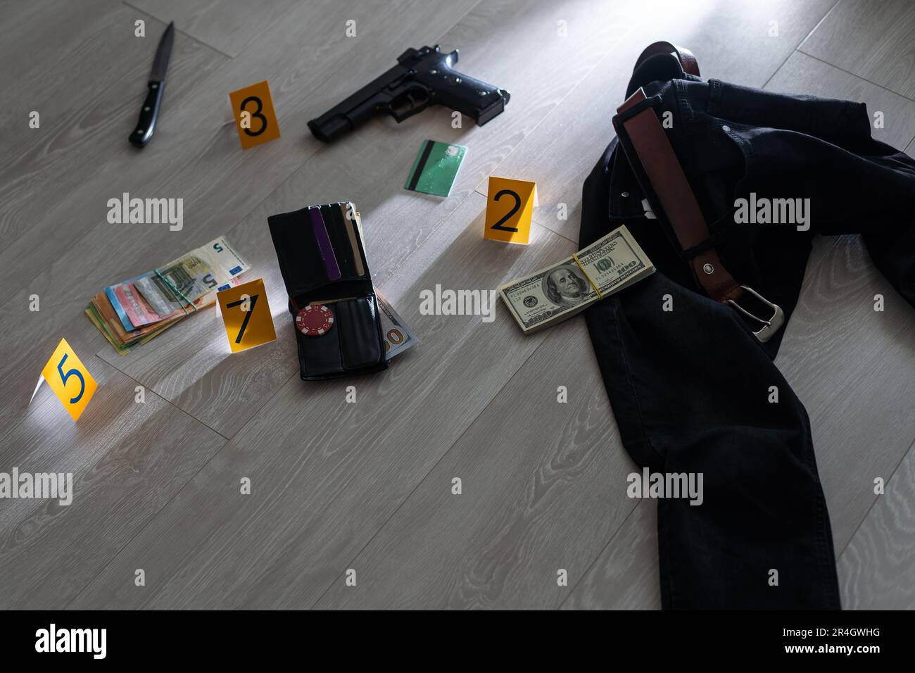 Crime scene investigation concept - Pistol and bullet shell against the ...
