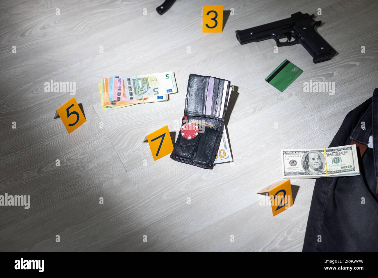 Flat lay composition with evidences and crime scene markers on wooden ...