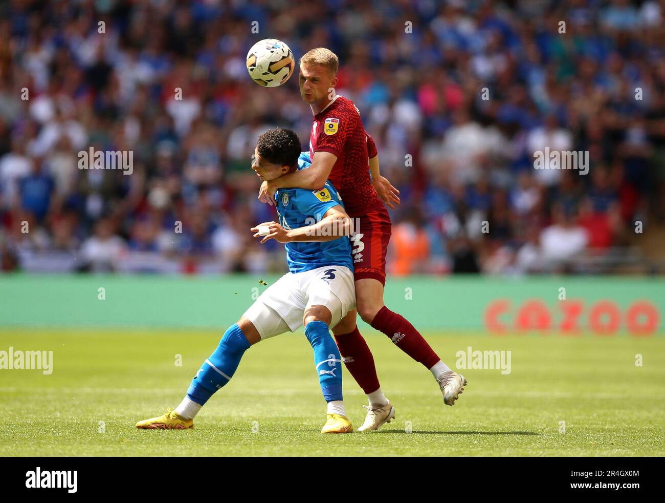 Stockport County's Kyle Knoyle and Carlisle United's Jack Armer battle ...