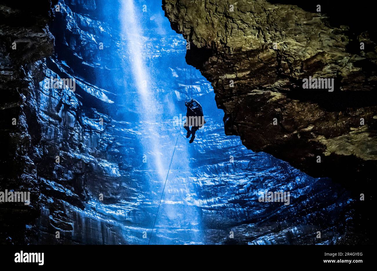 A potholer is winched into Gaping Gill, the largest cavern in Britain ...