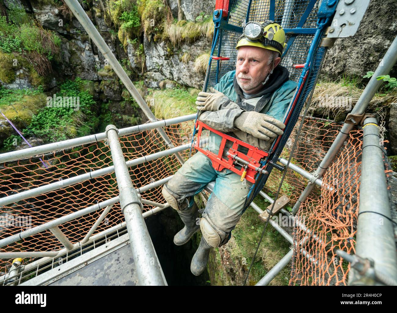 A potholer is winched into Gaping Gill, the largest cavern in Britain ...