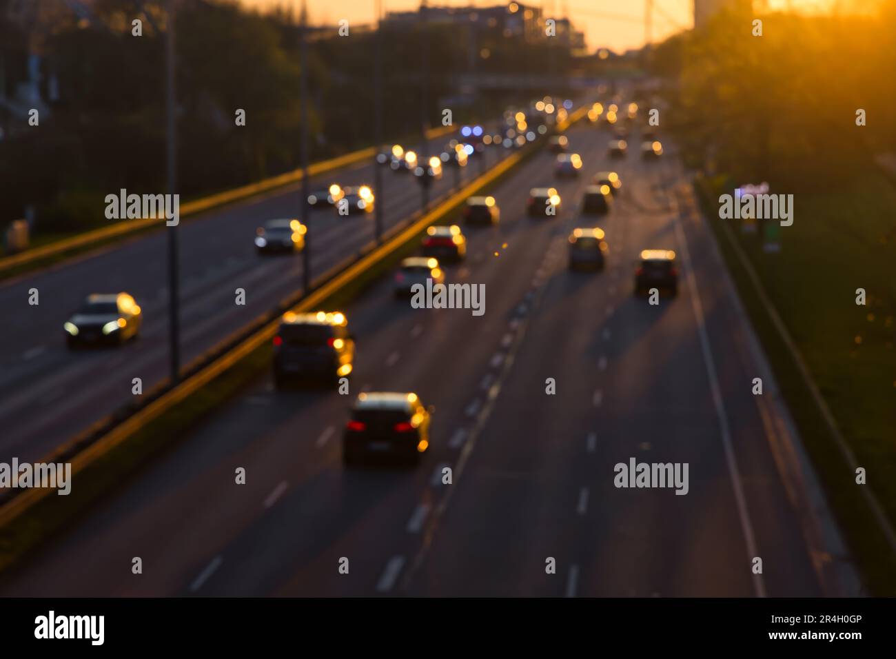 out of focus picture of a highway with busy traffic at sunset Stock ...