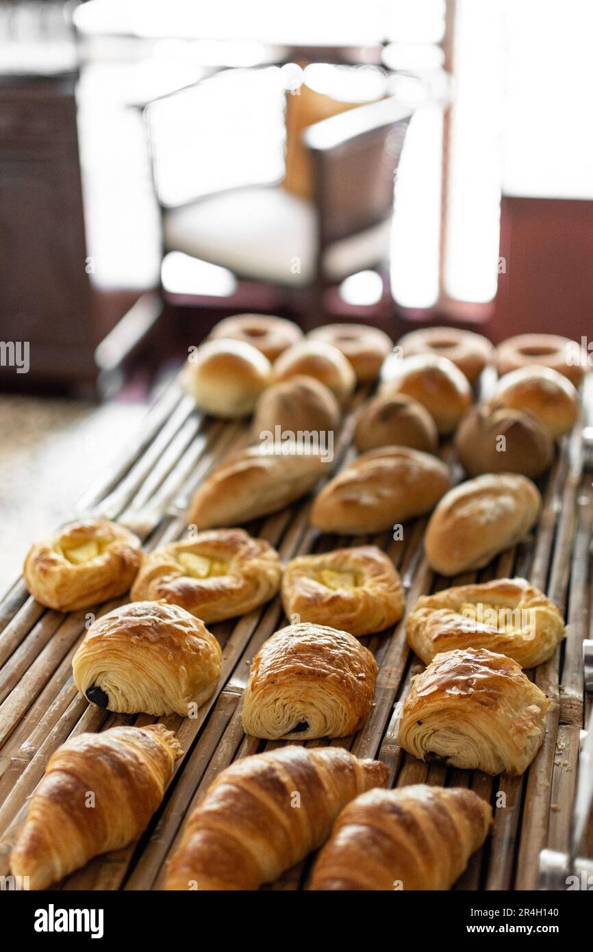selection of traditional pastries and bread on display in french cafe ...