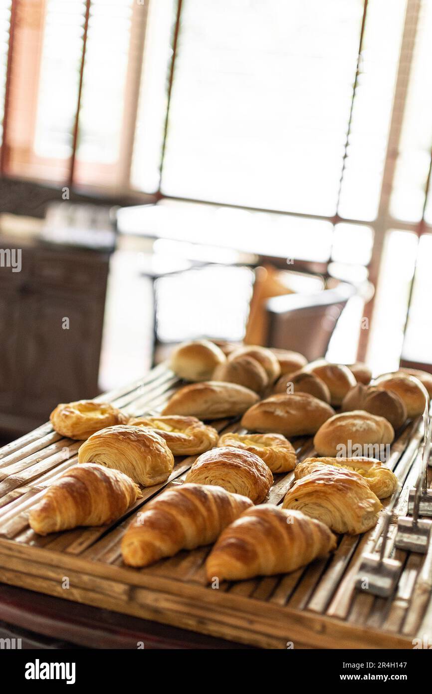 selection of traditional pastries and bread on display in french cafe ...