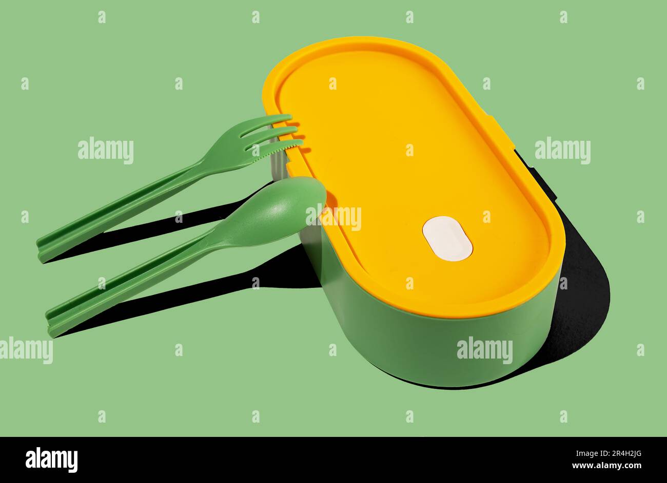 Lunch box and plastic fork, spoon. Lunchbox container closed with lid ...