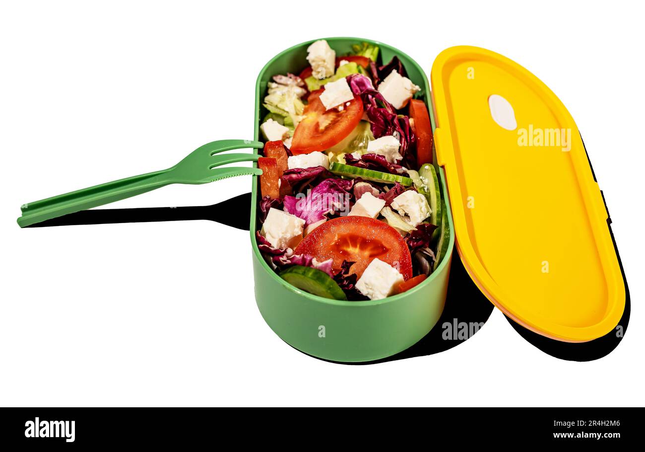 Healthy salad in plastic lunch box. Vegetable mix inside lunchbox with ...