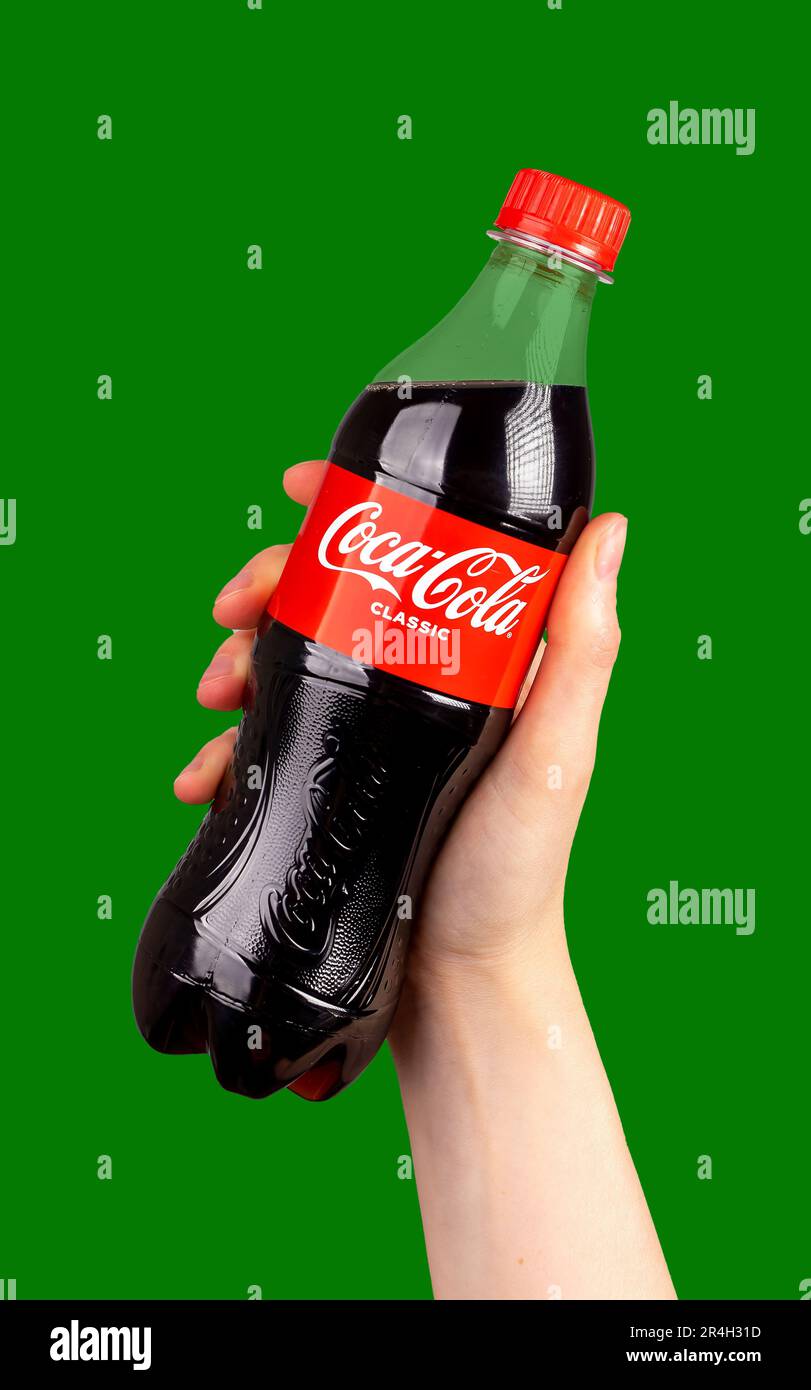 Berlin Germany May 23 2023 Hand holding Cola drink, packed in plastic ...