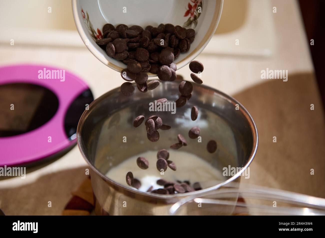 Close-up chips of organic dark belgian chocolate spilling out from a ...
