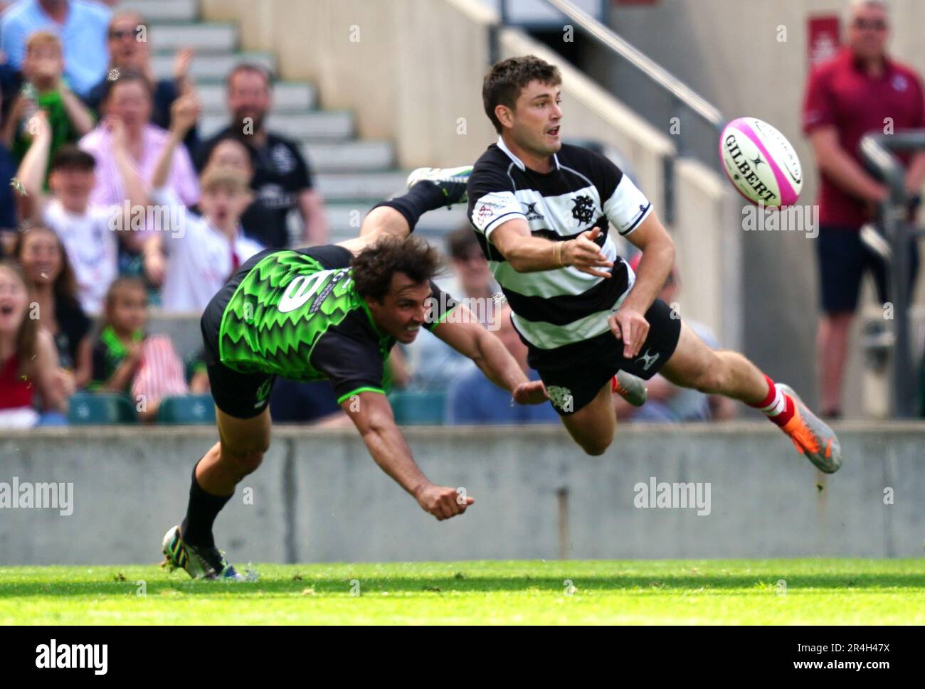 World XV's Nick Phipps (right) releases the ball from pressure by ...