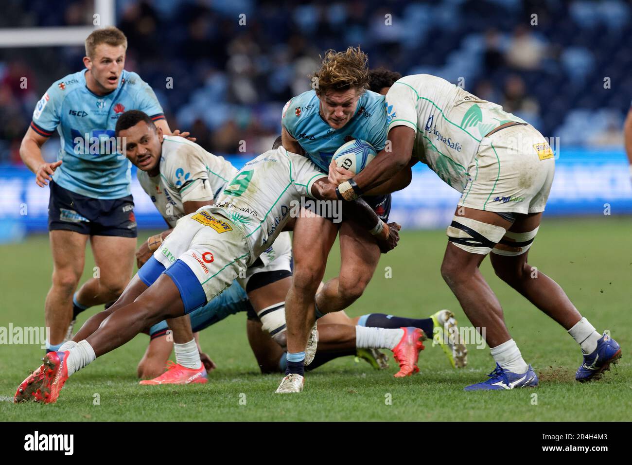 Michael Hooper of the Waratahs is tackled during the Super Rugby ...