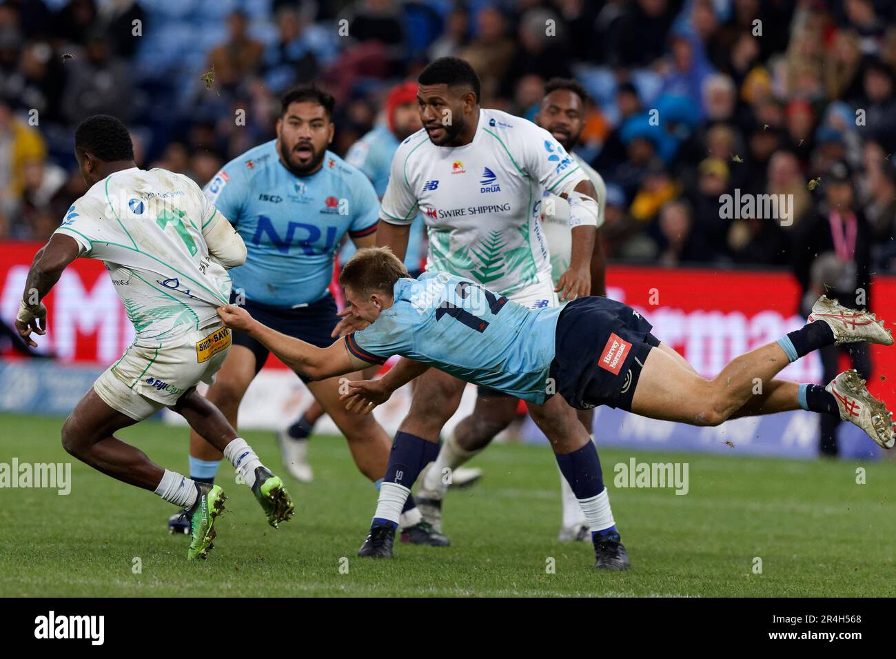 Taniela Rakuro of Fiji is tackled by Joey Walton of the Waratahsduring the Super Rugby Pacific ...