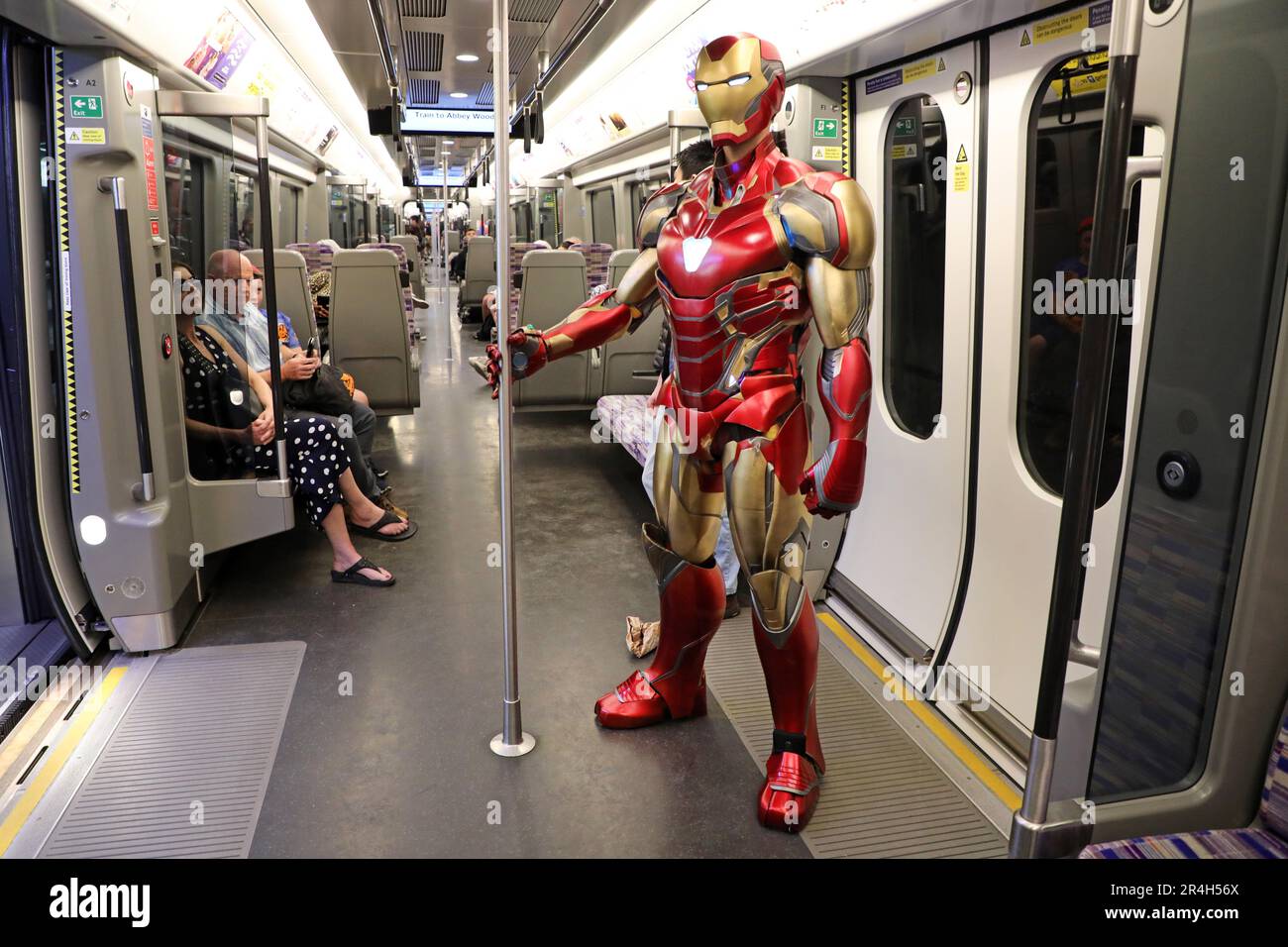 London, UK. 28th May, 2023. Iron Man riding the Elizabeth Line to MCM ...