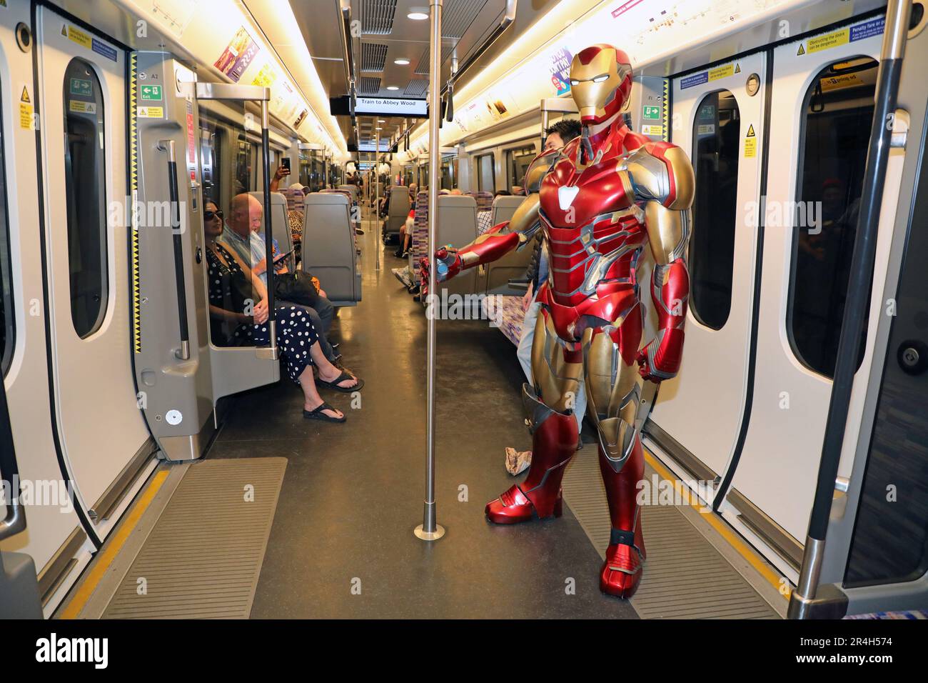 London, UK. 28th May, 2023. Iron Man riding the Elizabeth Line to MCM ...