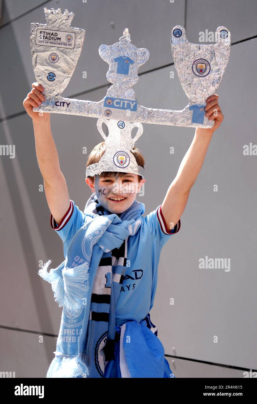 A Manchester City fan ahead with a home made trophy sign, pictured ...
