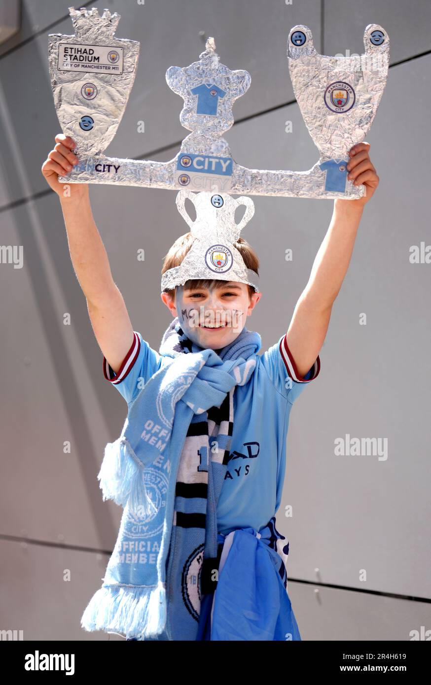 A Manchester City fan with a home made trophy sign, pictured ahead of ...