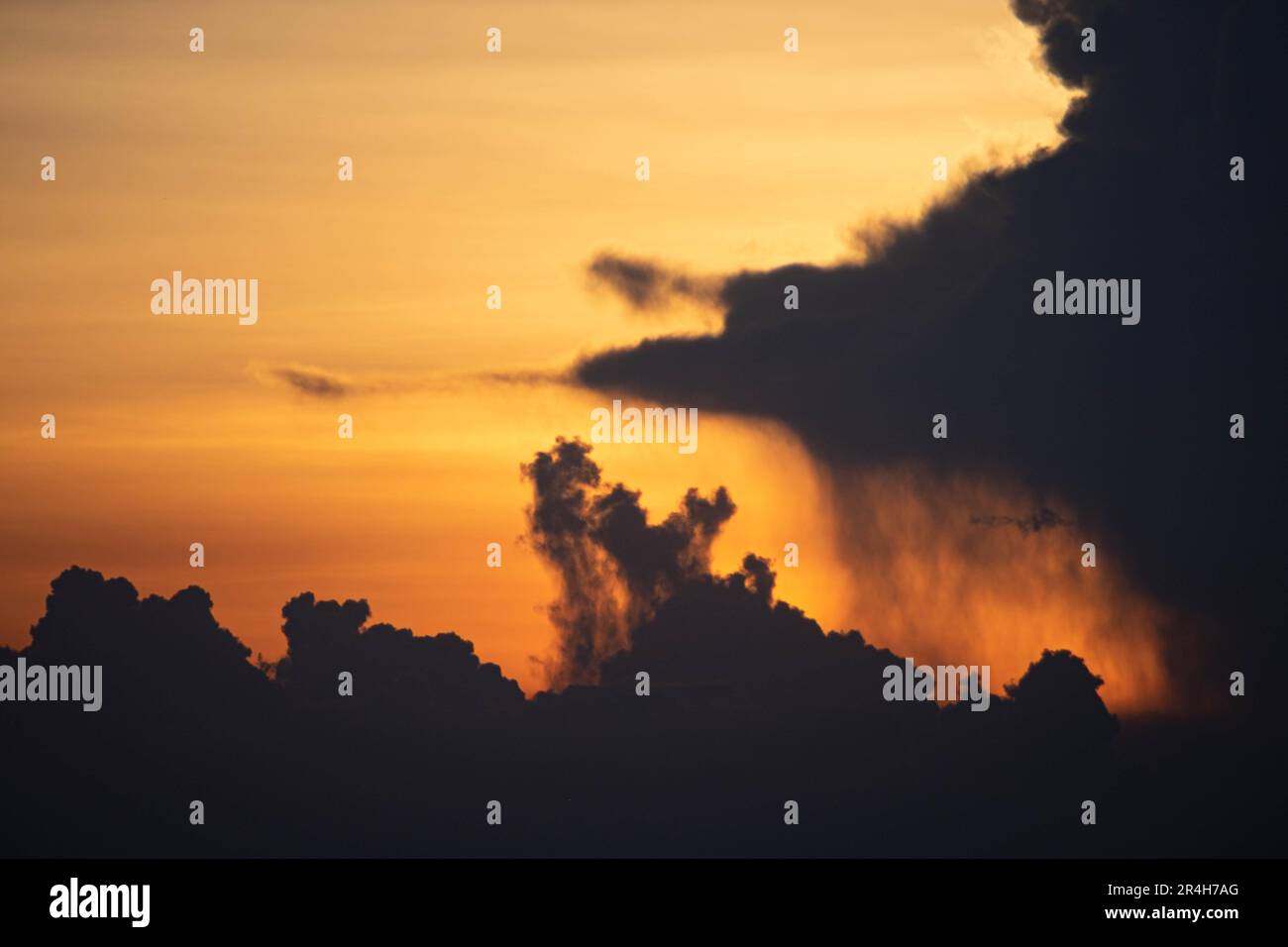 Evening sky sunset. big puffy cumulus and long stratus clouds. sky ...
