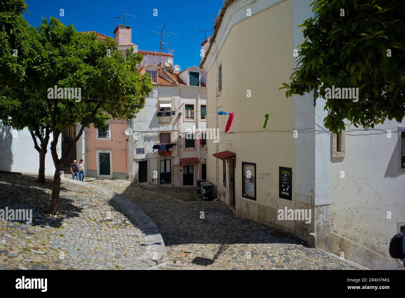 The narrow streets of the Alfama district in Lisbon are interesting to ...
