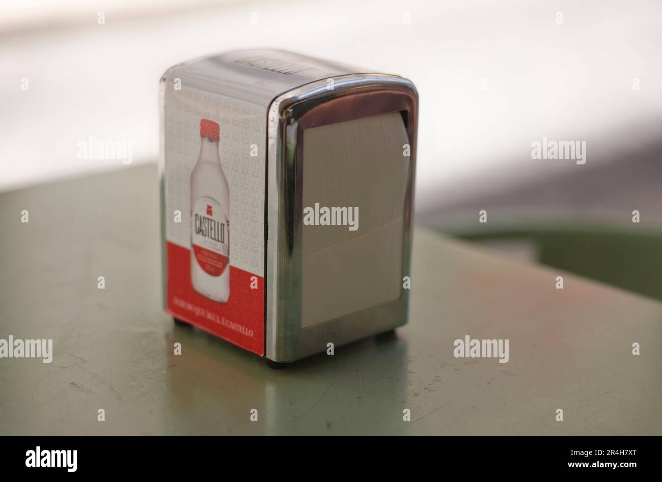 A napkin dispenser on a restaurant table in Lisbon advertising Agua ...