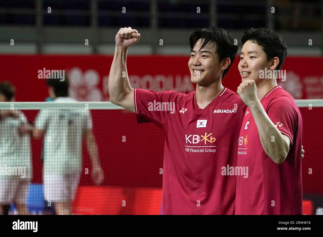 South Korea's Kang Min Hyuk, second right and Seo Seung Jae pose after winning against Malaysia ...
