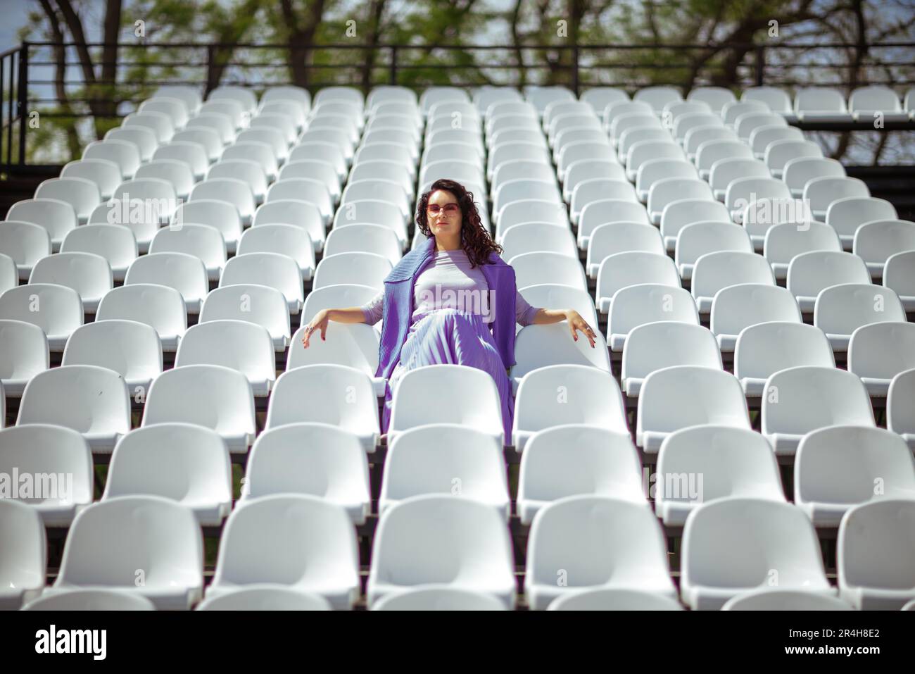 Woman Seats of tribune on sport stadium. Concept of fans, chairs for ...