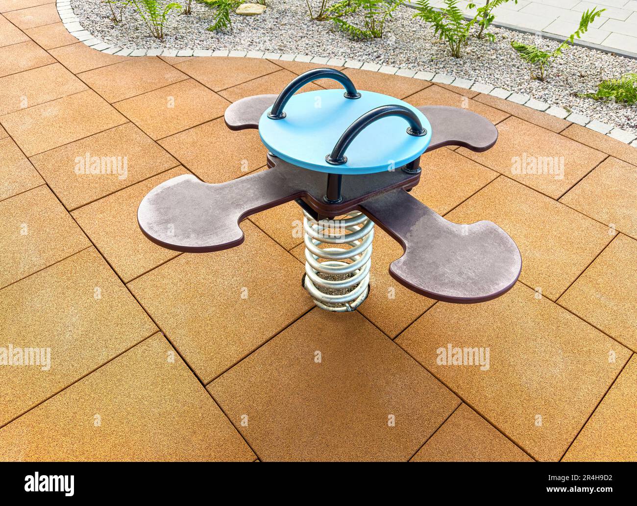 Children's rocking chair on the playground Stock Photo - Alamy