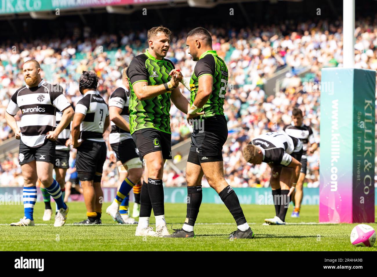 Elliot Dee of the World XV congratulates Bryn Hall on his try during ...