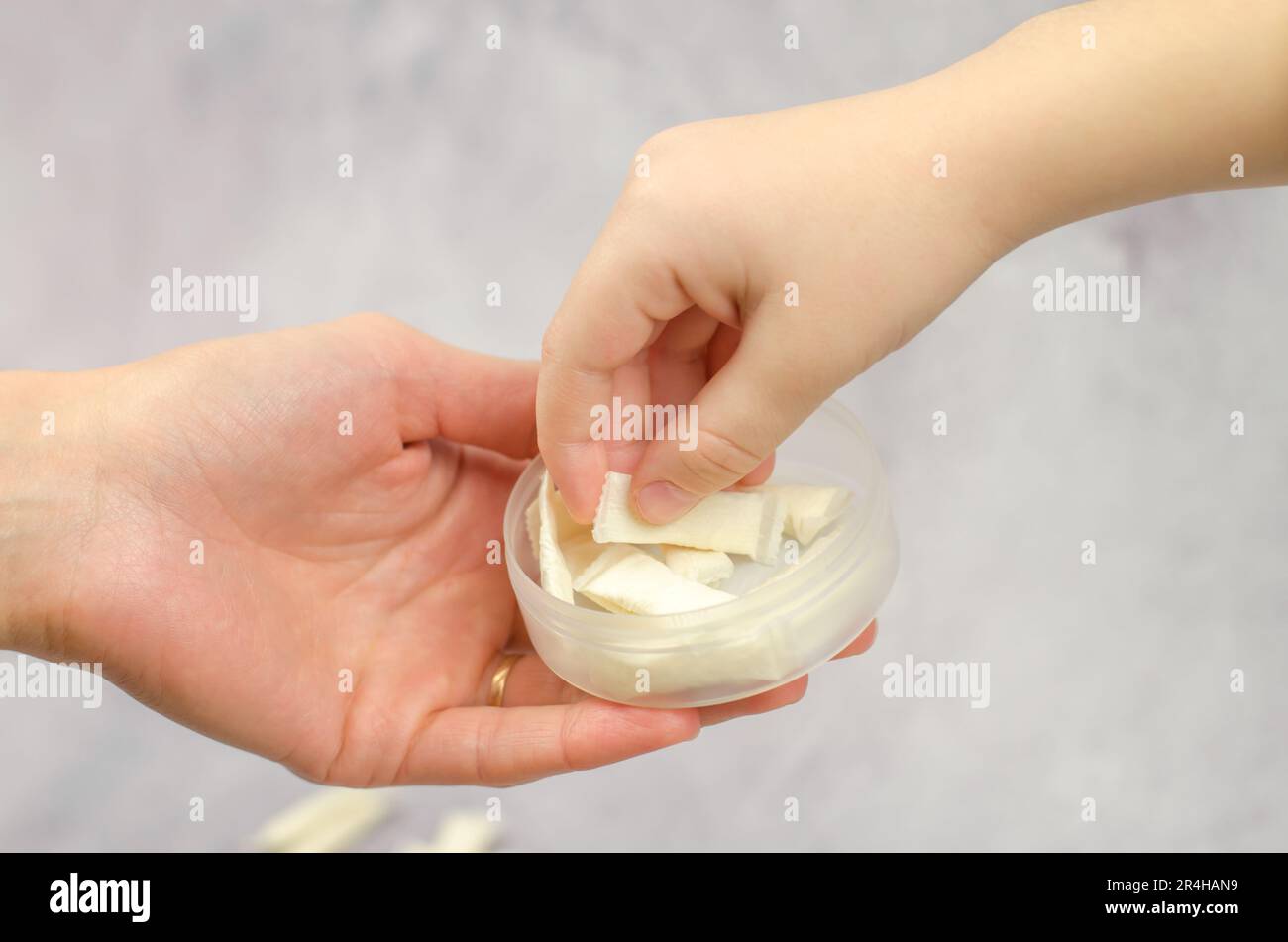 A woman gives Swedish snus to a child, close-up Stock Photo - Alamy