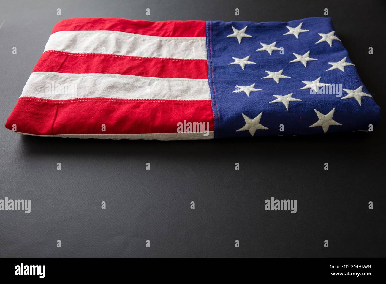 American flag folded on black background, US America National Holiday ...