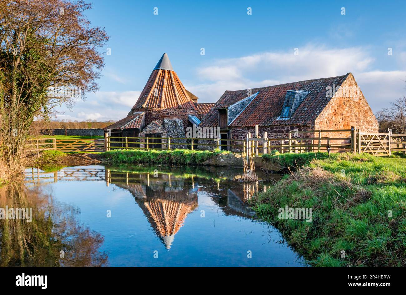 Quirky old Preston Mil reflected in the mill pond (an Outlander film ...