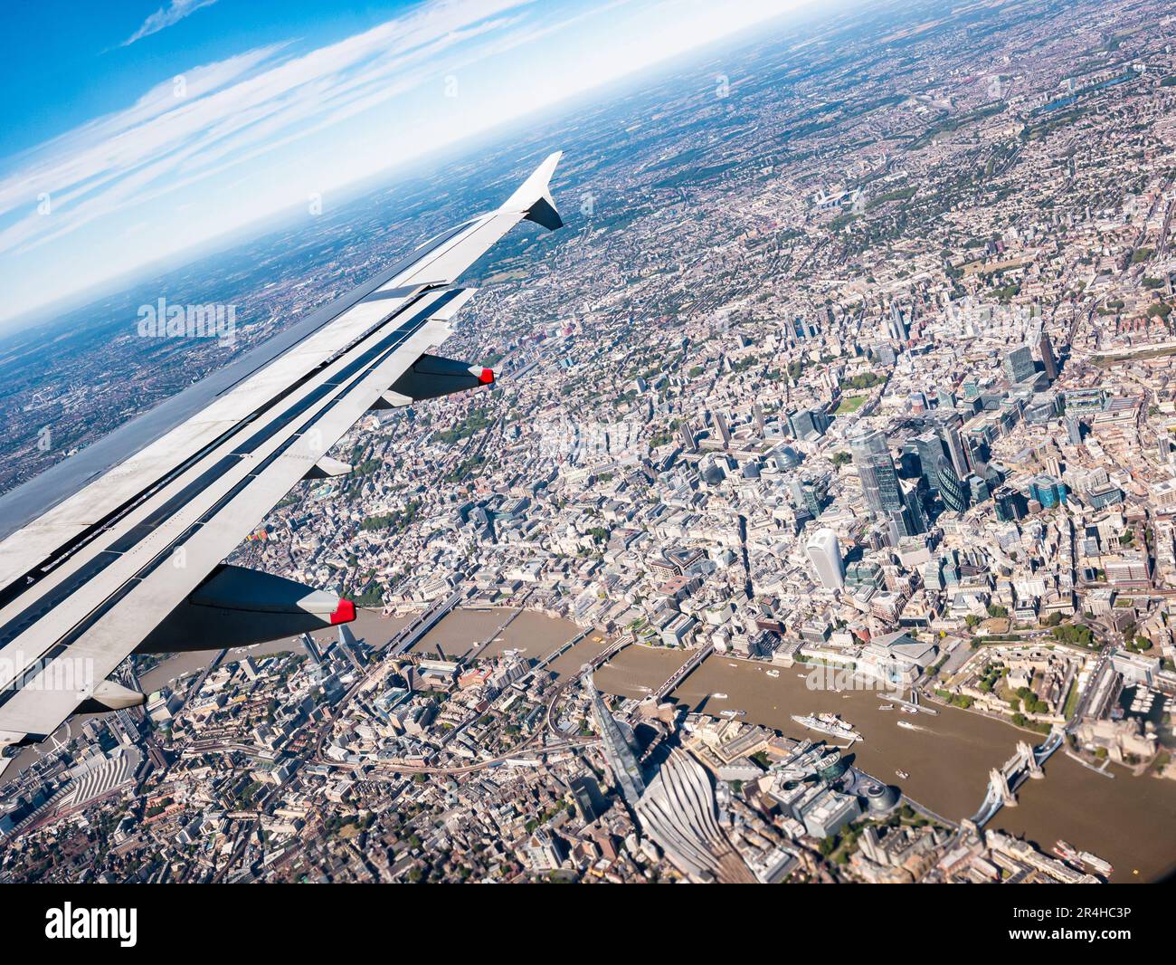 View from plane window over River Thames & City of London skyscrapers ...
