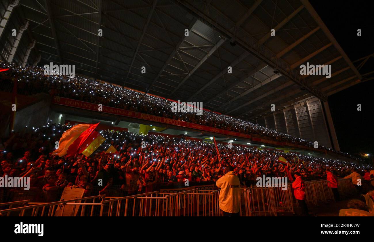 Stands Tribune Delacourt pictured in the dark with their fans and ...
