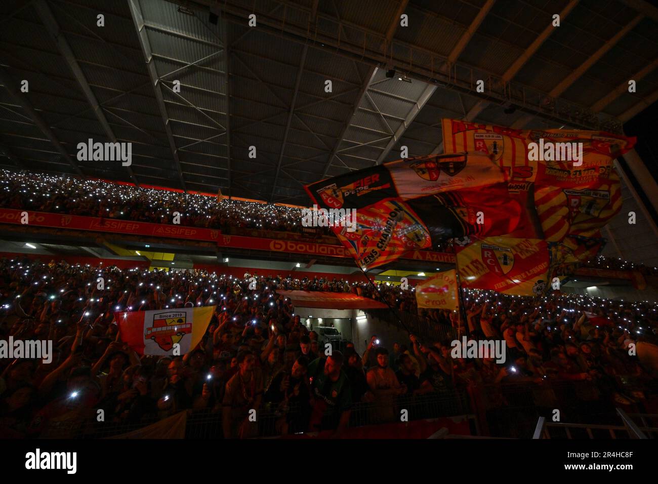Stands Tribune Delacourt pictured in the dark with their fans and ...