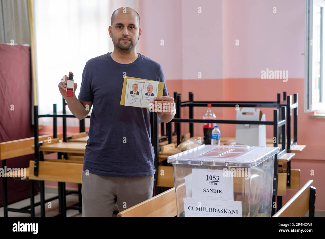 The man is Turkish presidential election. The man is holding the ballot ...