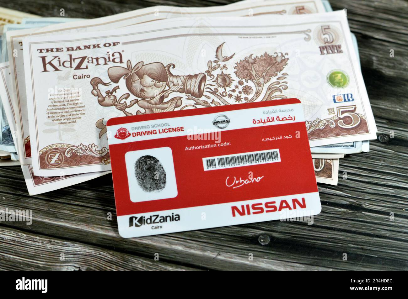 Cairo, Egypt, May 26 2023: KidZos money, Driving license of KidZania, a ...