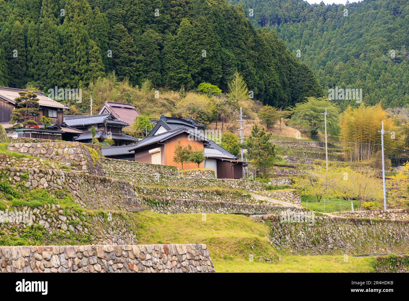 Houses in small farming community atop stone terrace walls in mountains ...