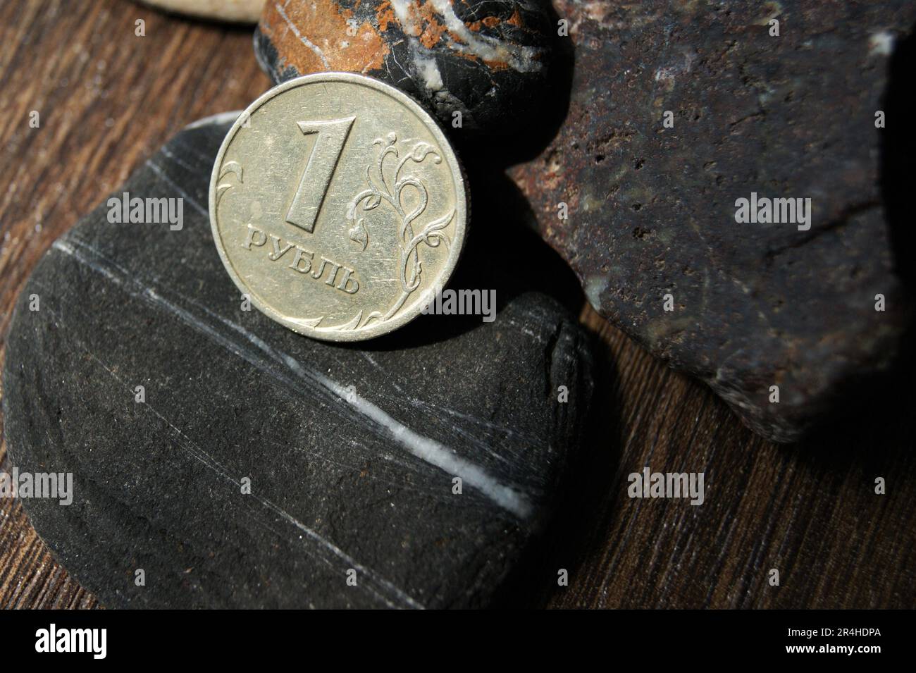 1 ruble on stones. Russian currency Stock Photo - Alamy