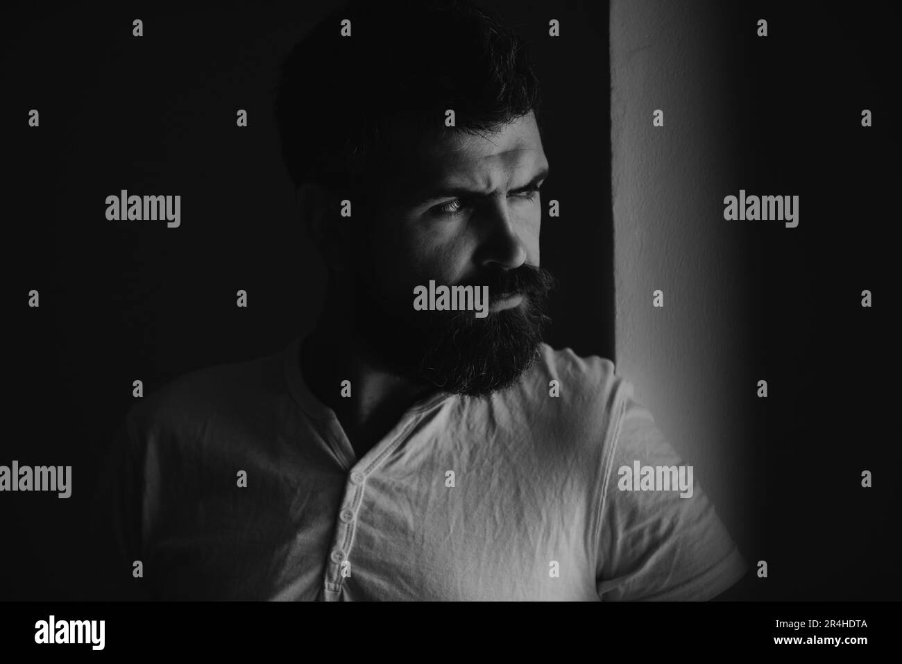 Shadow male face. Close up portrait of guy with serious profile face ...