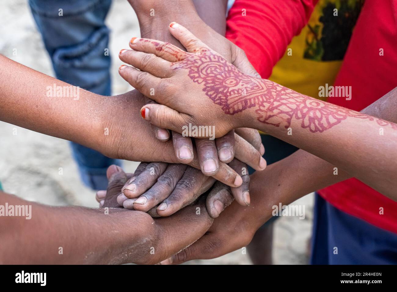 The hands of the children together. Close-up of team work while ...