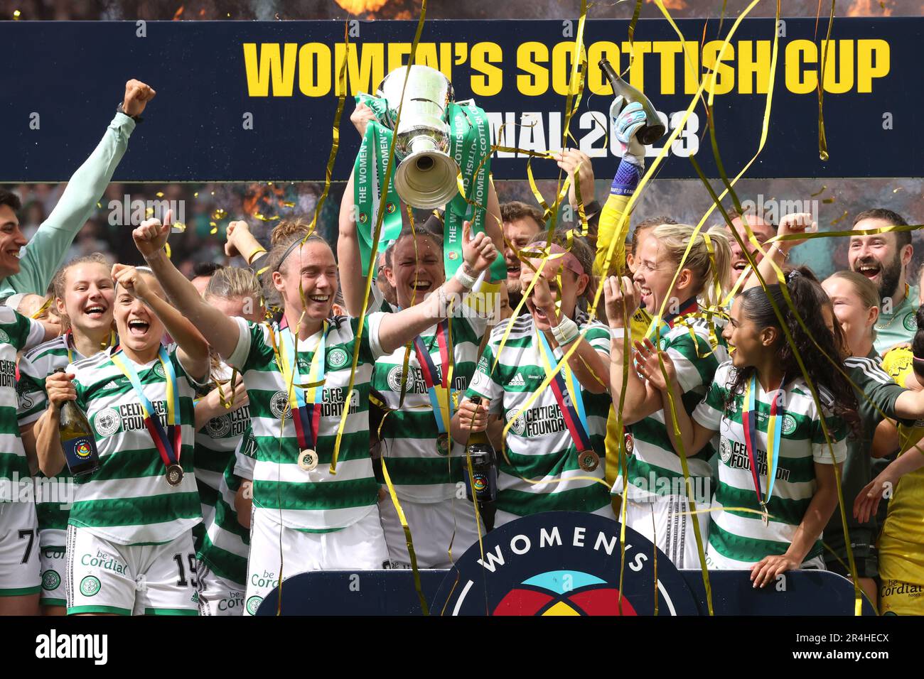 Celtic's Kelly Clark (centre) celebrates with team-mates whilst lifting ...