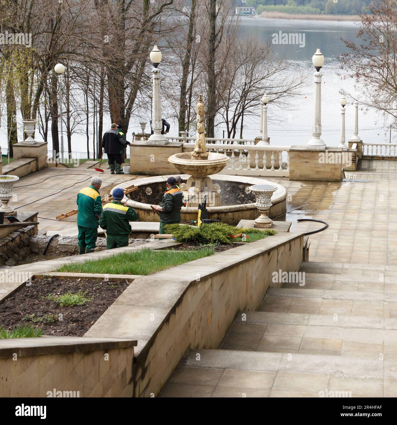 Communal professional workers carry out spring cleaning of fountains ...